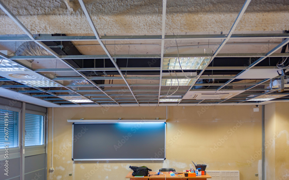 repairing board ceiling with gypsum. In the classroom Stock Photo ...