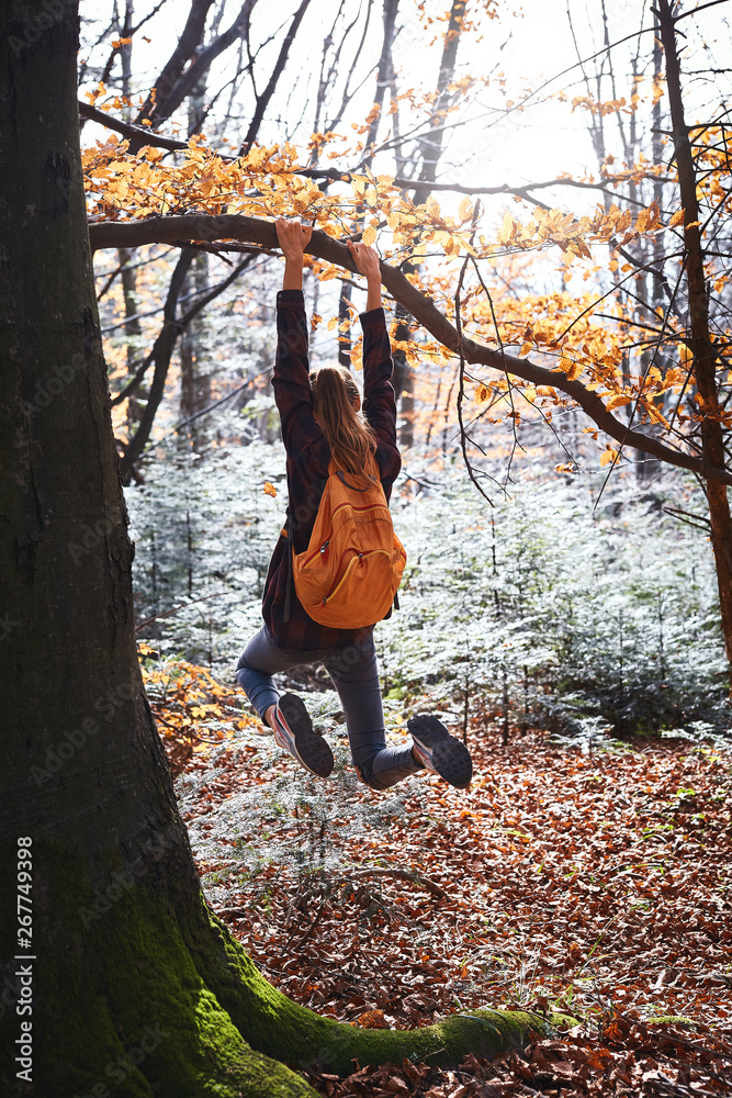 Girl Hanging From Tree