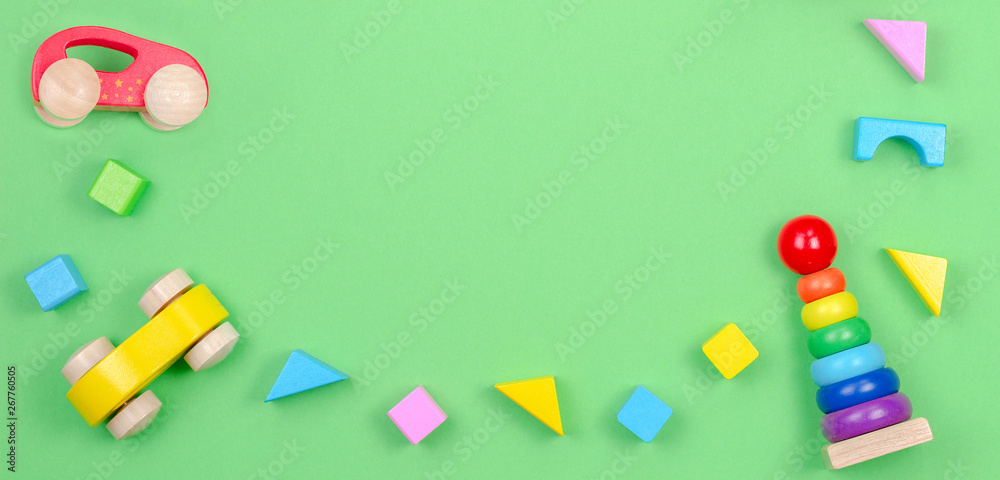 Kids toys background frame with baby stacking rings pyramid,, wooden ...