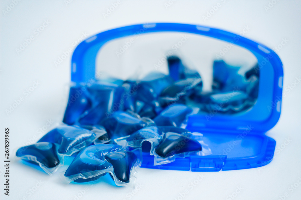 Washing gel capsules. Liquid detergent for washing machine. Blue duo ...