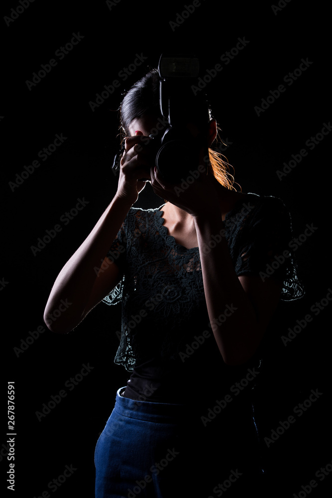 Asian Woman Photographer hold camera with external flash point to shoot ...