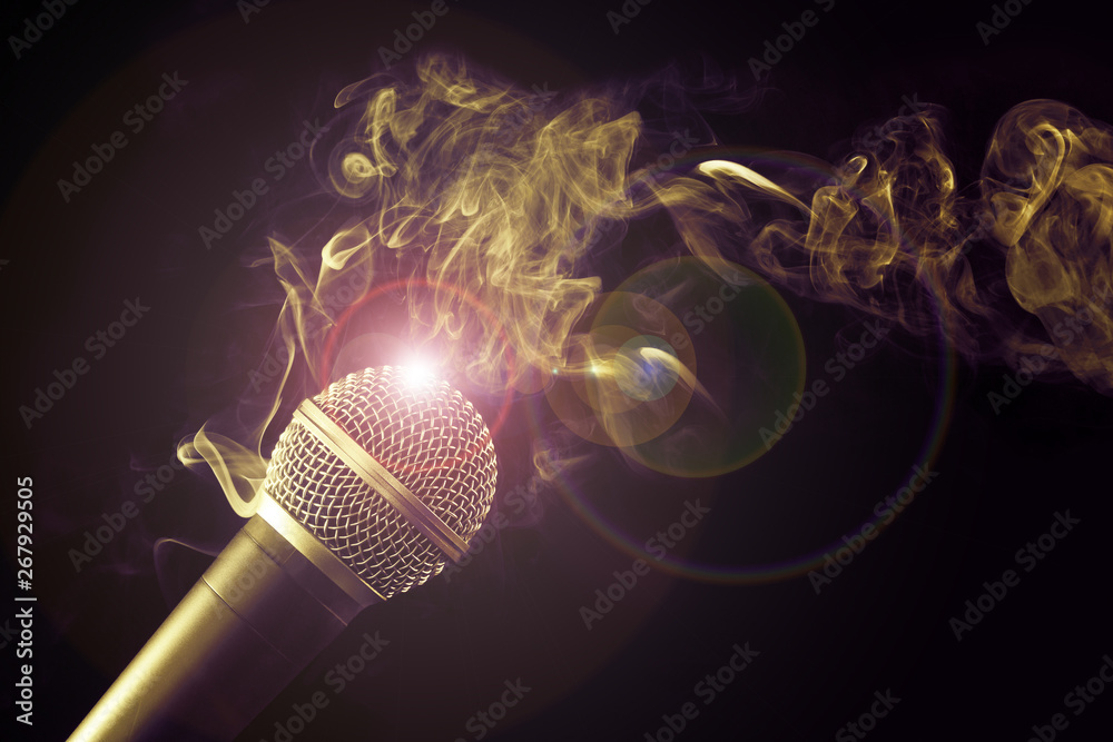 microphone and swirl of smoke on black background Stock Photo | Adobe Stock