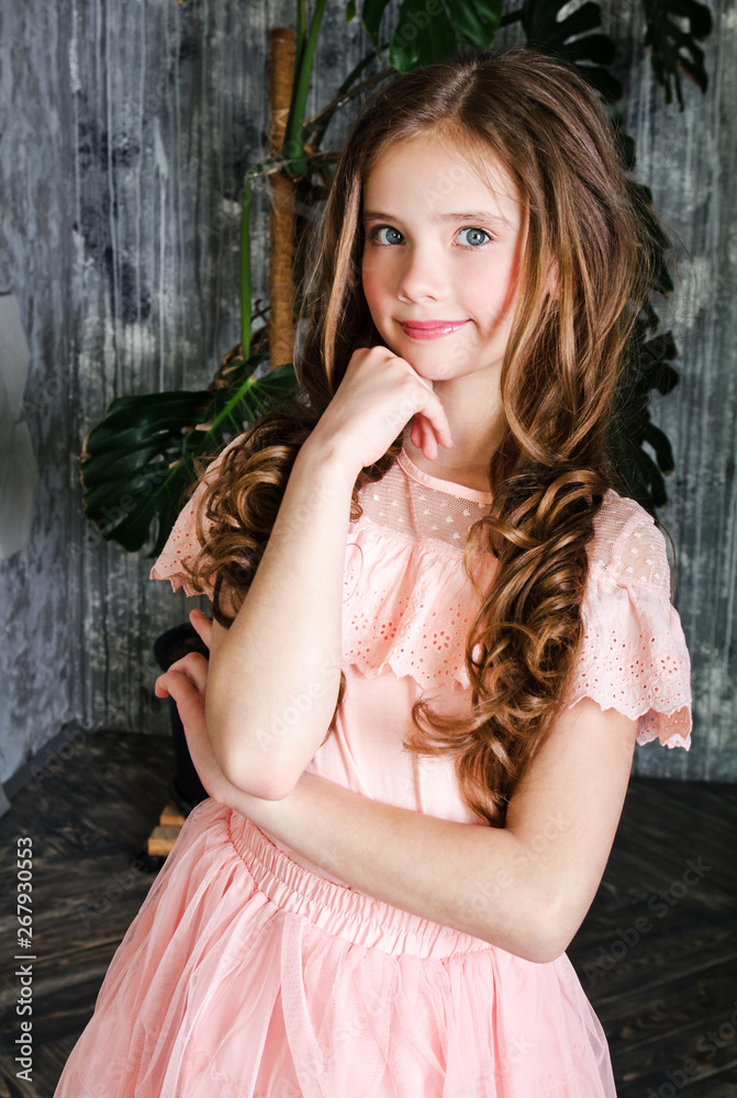 Portrait of adorable smiling little girl child schoolgirl in princess ...