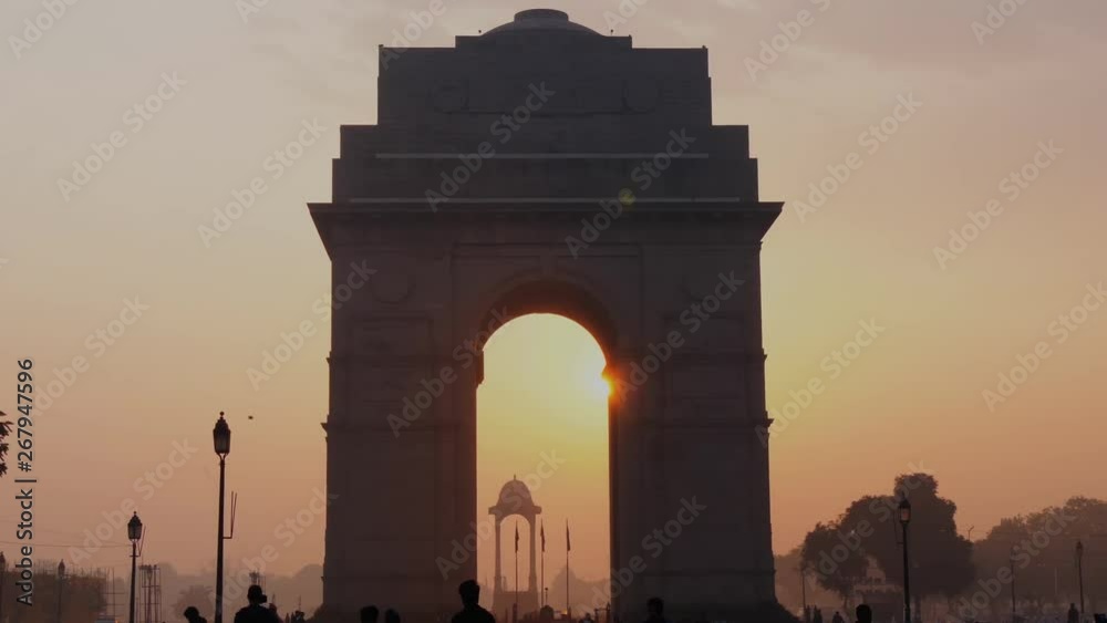 historic india gate at sunrise with sun lens flare at new delhi, india ...