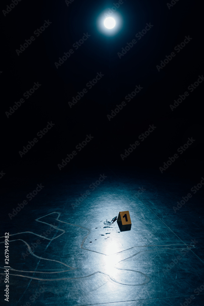 chalk outline, knife and evidence marker at crime scene Stock Photo ...