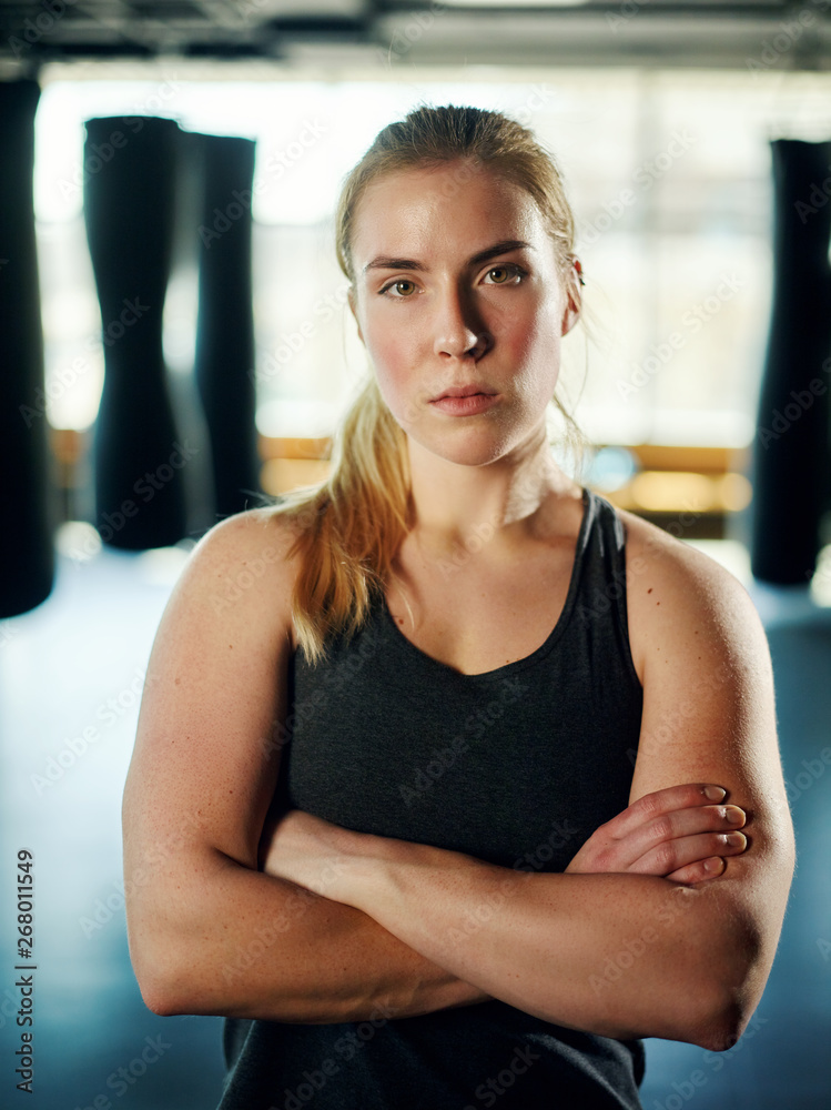 Waist up portrait of strong confident woman standing with her arms ...