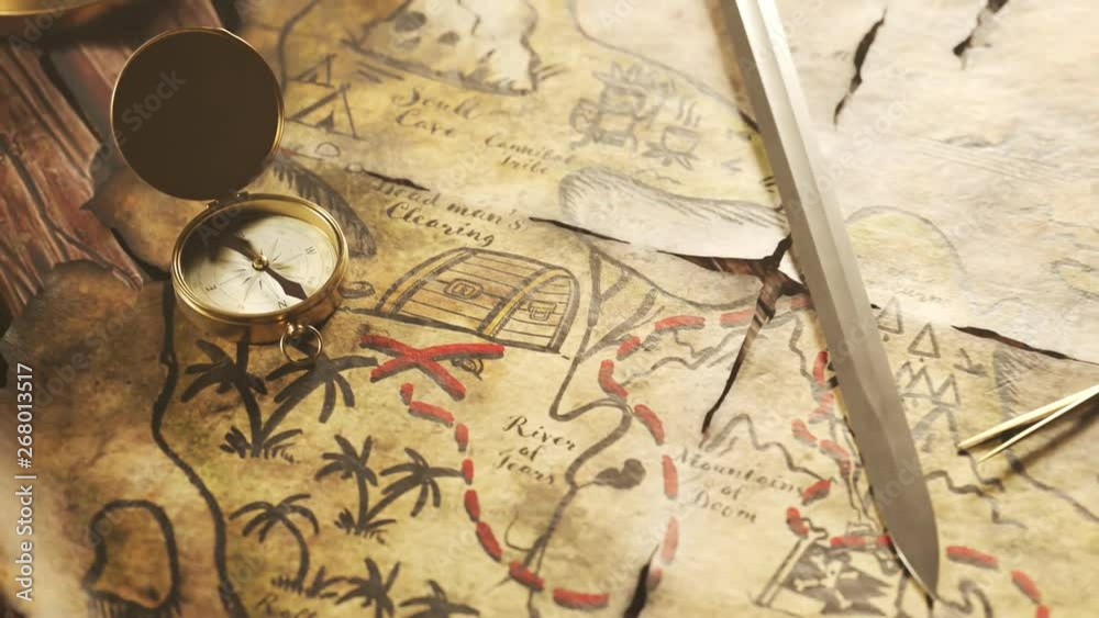 Old, worn handmade treasure map on a cartoon tavern table with sword ...