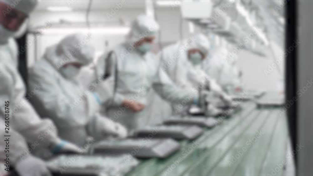 Blurred view of Innovative production of TVs, view of the assembly line ...