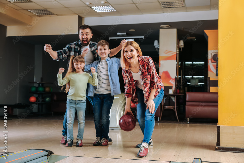 Family playing bowling in club Stock Photo | Adobe Stock