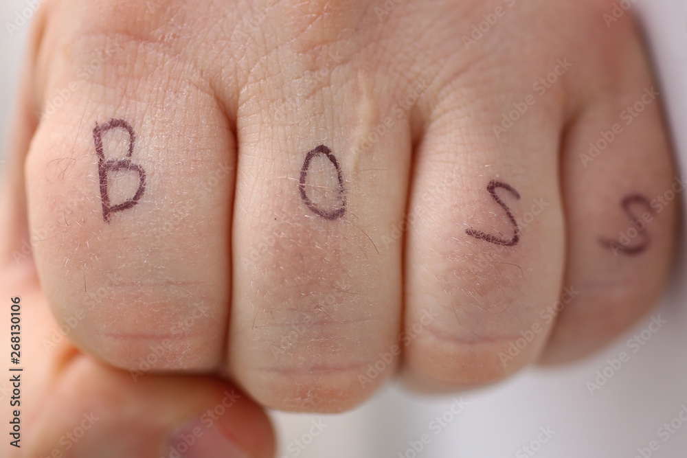Male clenched fist in suit at office closeup. Aggressive career ...