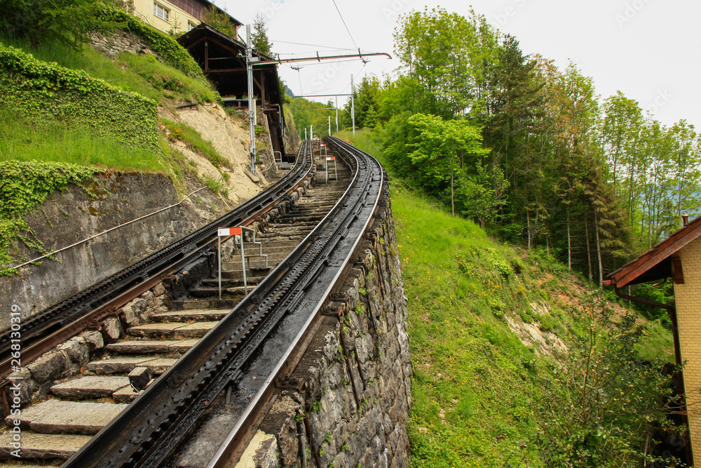 View of cogwheel railway tracks from on Pilatus Railways train in ...