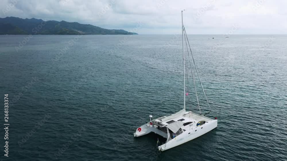 CLOSE UP, Top view of the boat. Aerial View of a Anchored Catamaran ...