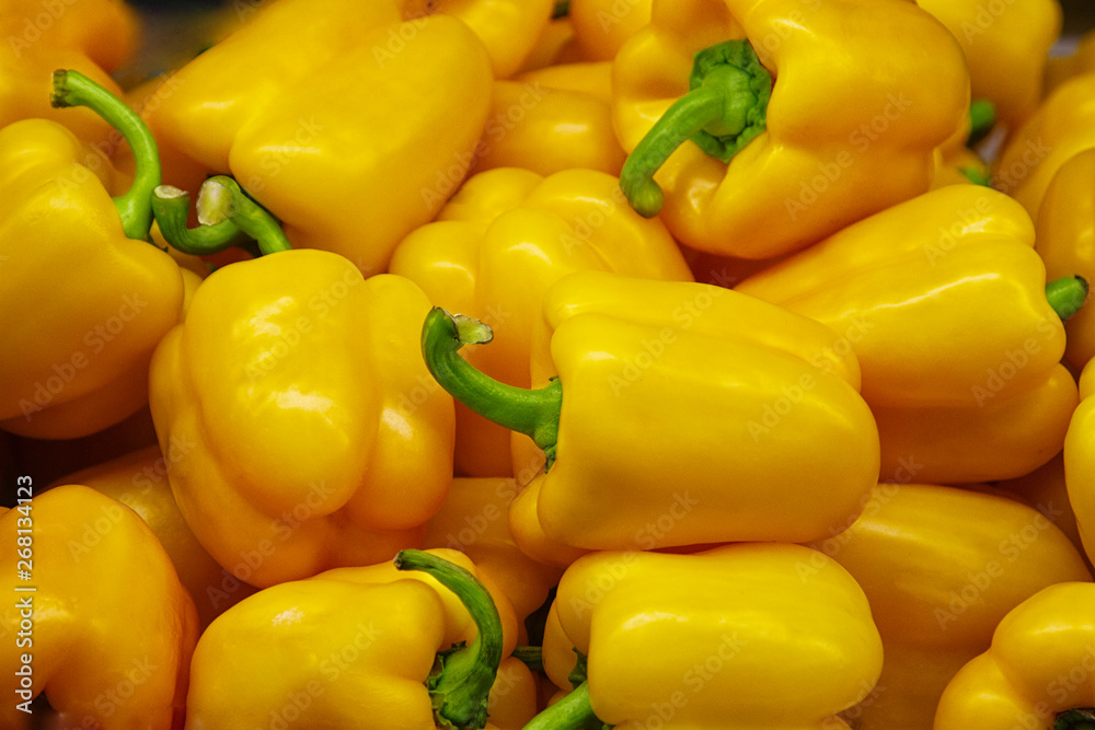 Fresh yellow pepper lying on the market counter. Yellow pepper texture ...