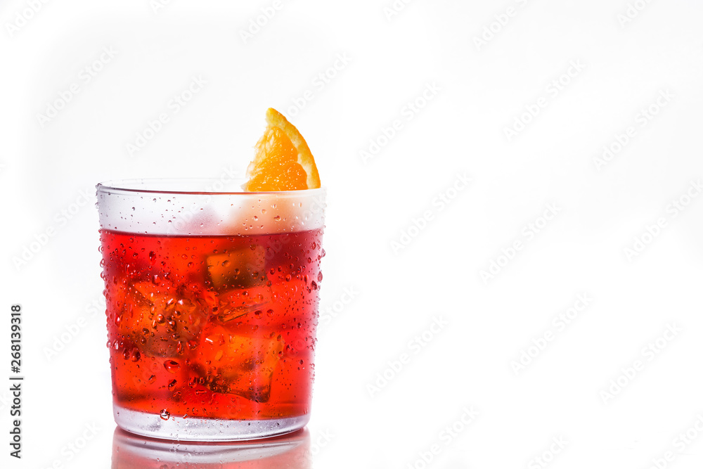 Negroni cocktail with piece of orange in glass isolated on white ...