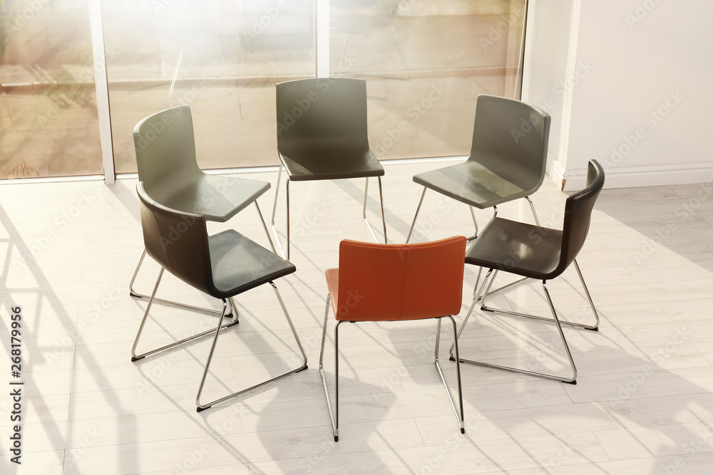 Chairs prepared for group therapy session in office. Meeting room ...