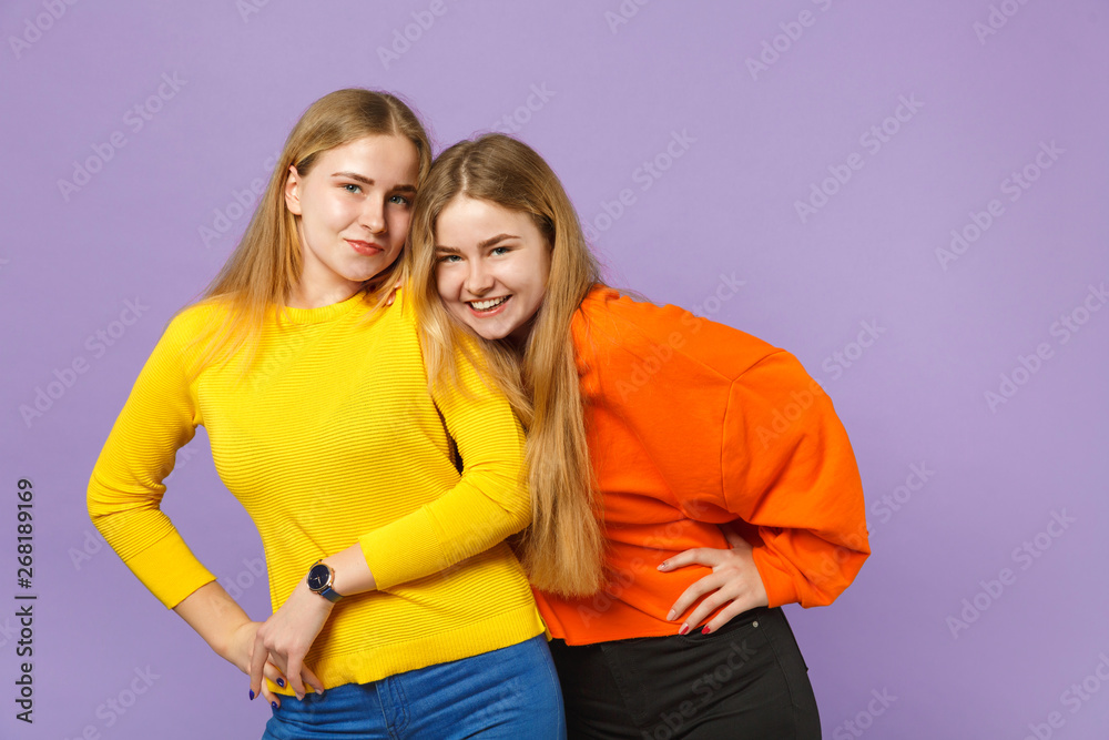 Two Pretty Smiling Young Blonde Twins Sisters Girls In Vivid Colorful