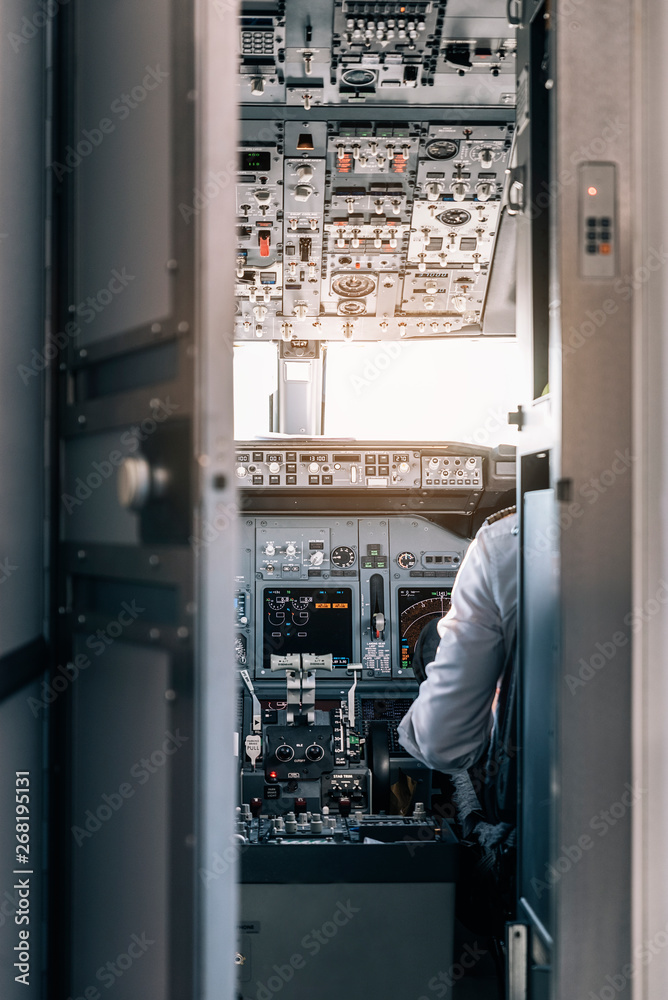Pilot and copilot inside a cabin flying an airplane. Stock Photo ...