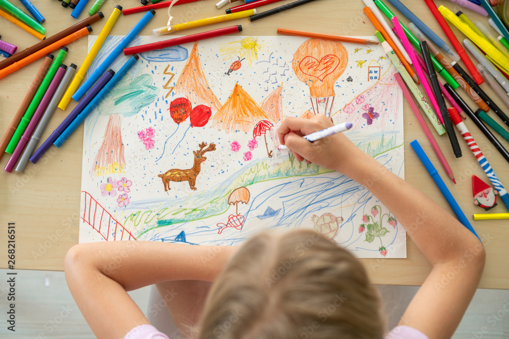 Child drawing with color pencils Stock Photo | Adobe Stock