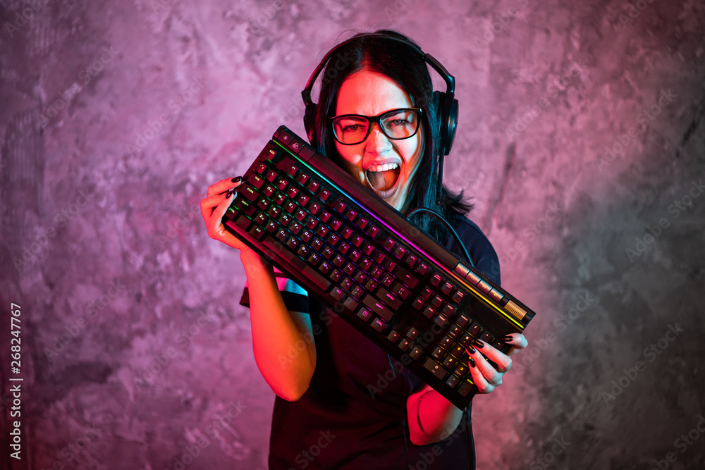 Professional Girl Gamer in MMORPG Strategy Video Game. She's She posing ...