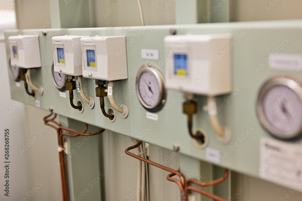Pressure regulators with analogue indicator. Stock Photo | Adobe Stock