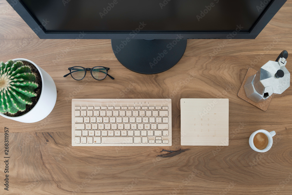 Top view office table desk. Workspace with large monitor screen, a ...