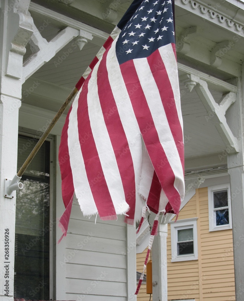 Torn and tattered US flag ready to be retired Stock Photo | Adobe Stock