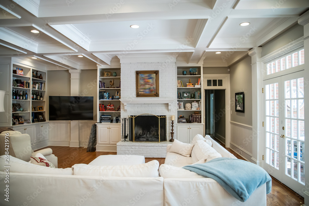 Large Living Room Den in Home with Vaulted Tray Ceiling and bookshelves ...