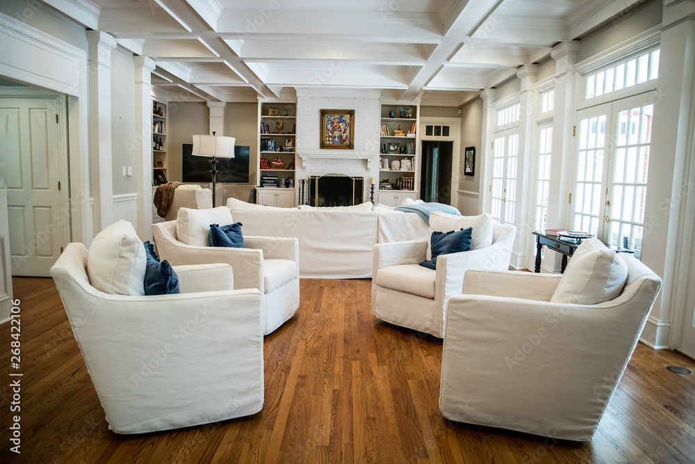 Large Living Room Den in Home with Vaulted Tray Ceiling and bookshelves ...