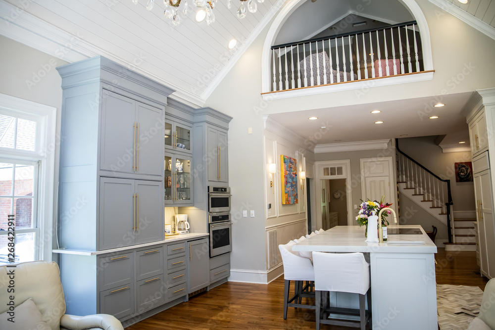 View of Upper Loft of Open Concept Home with eat in kitchen and Wood ...
