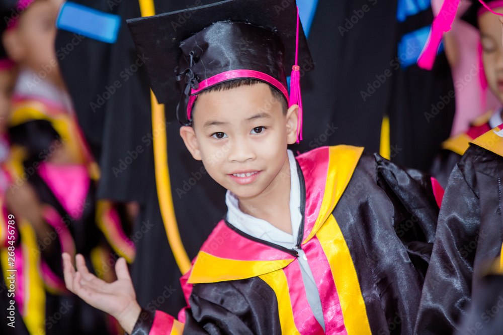 Graduation children receive a certificate. Stock Photo | Adobe Stock
