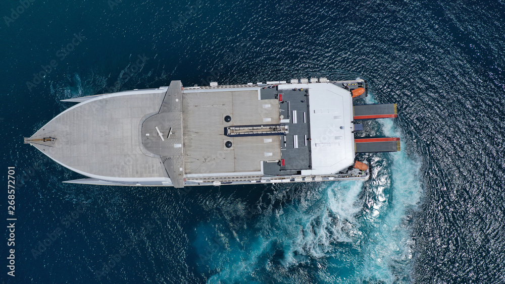 Aerial drone top view photo of high speed passenger ferry arriving at ...