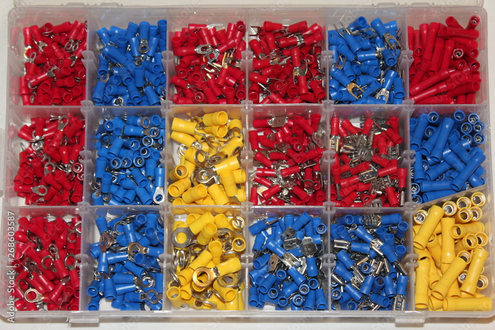 cable lugs with differents colours and sizes on a white background, for ...