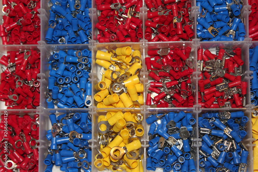 cable lugs with differents colours and sizes on a white background, for ...