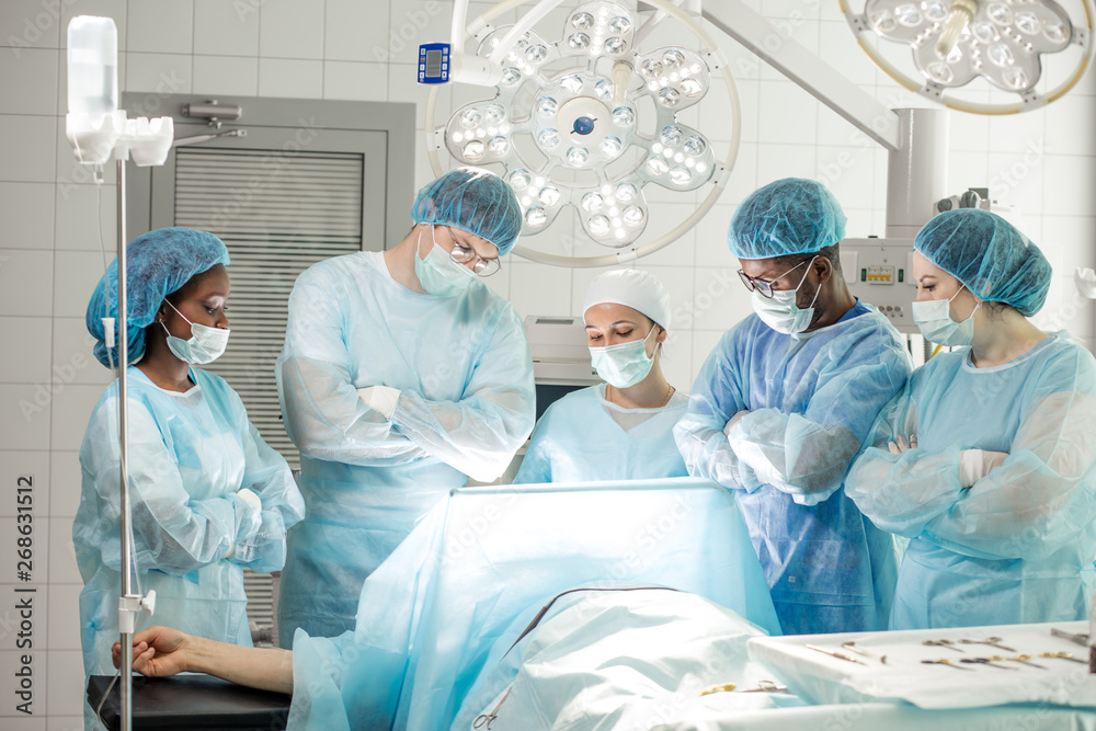 lying patient gesturing while sleeping under under anesthesia . patient ...