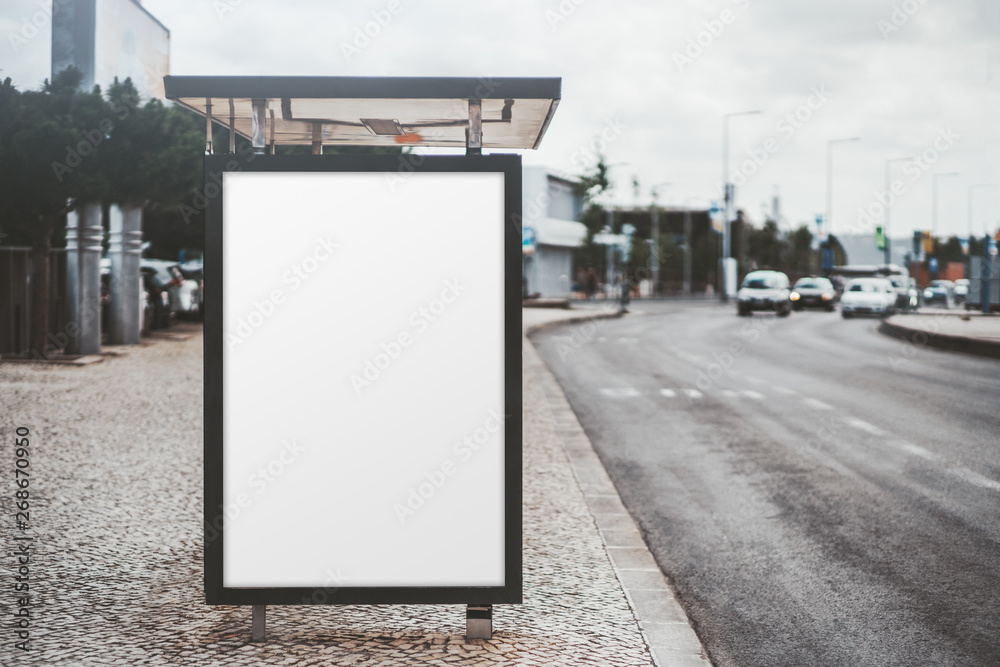 City bus stop on with an empty banner mockup; template of an ...