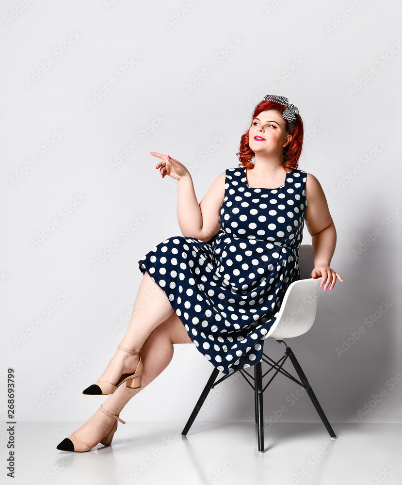Pin up a female portrait. Beautiful retro fat woman in polka dot dress ...