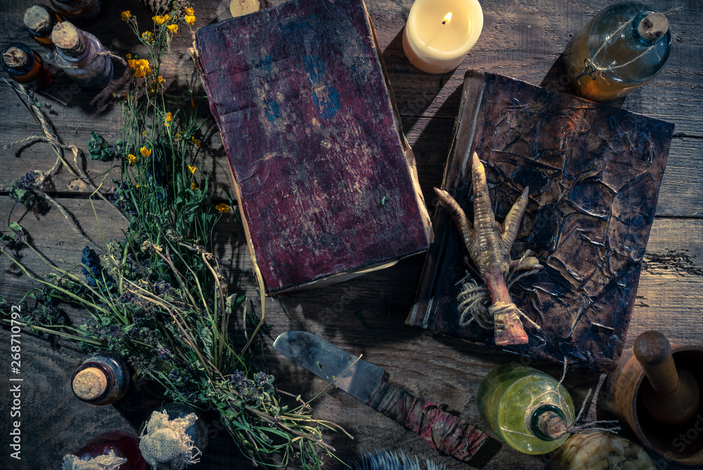 A witchery stuff: multiple tincture bottles, bunches of dry healthy ...