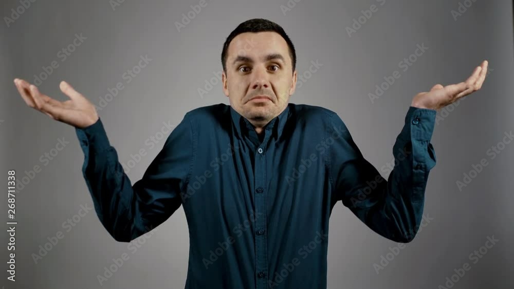 Closeup portrait of a young business man apologizes to the camera ...