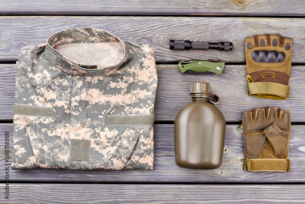 Military items arrangement. Flat lay, top view. Camouflage jacket ...