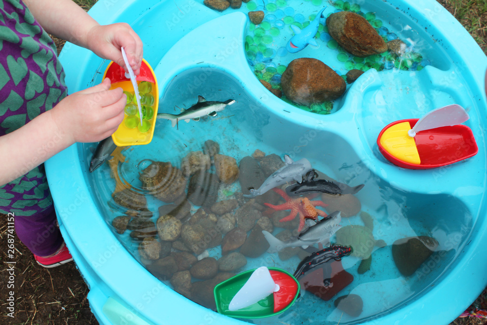 Children Playing with Boats and Sea Creature/Ocean Life Toys in a Water ...