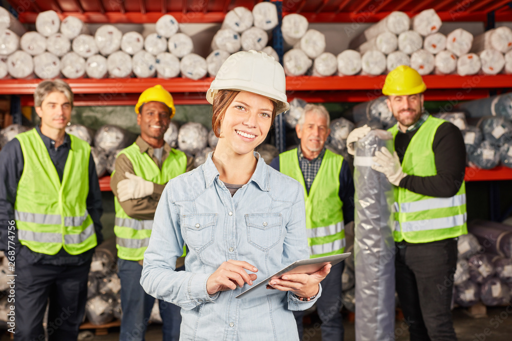 Lagerarbeiter und junge Frau als Azubi mit Tablet Stock Photo | Adobe Stock