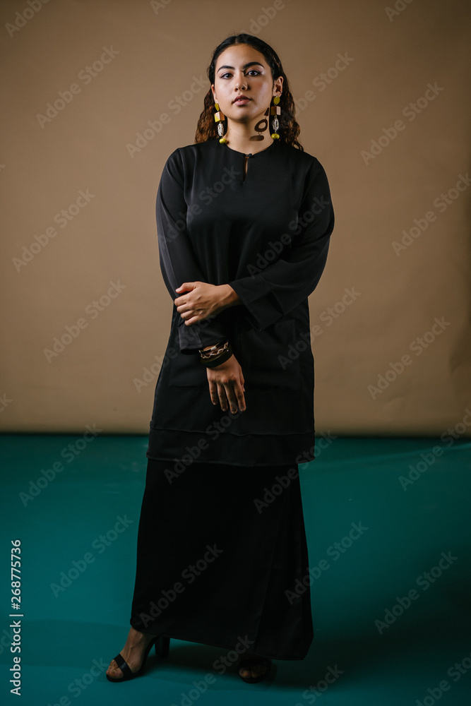 Studio portrait of a beautiful, young and attractive Middle Eastern ...