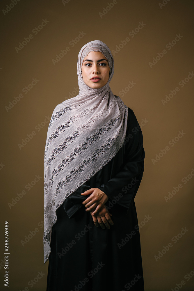 Studio portrait of a tall, slim, beautiful and elegant Middle Eastern ...