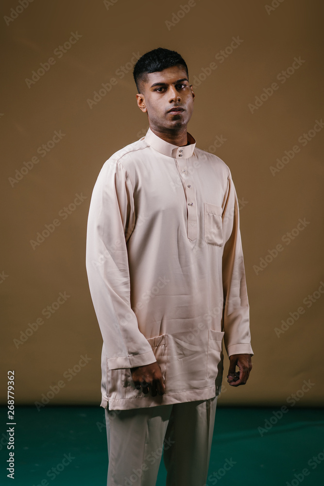 Studio portrait of a young, handsome and athletic Malaysian Indian ...