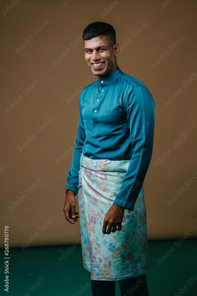 Studio portrait of a young, handsome and athletic Malaysian Indian ...