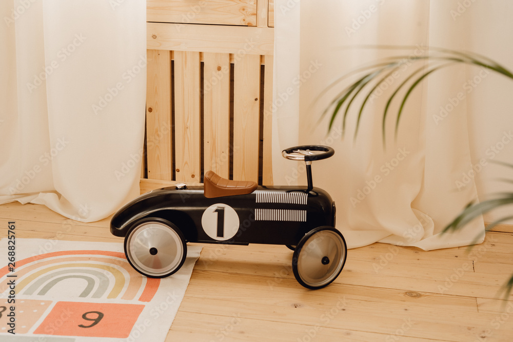 Old Style Toy Child Racing Car in Game Room. Black Vintage Race Vehicle ...