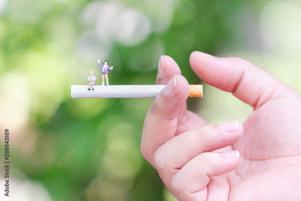 World no tobacco day. Cigarette and family figure. a concept for stop ...