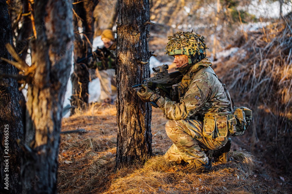 British special forces soldier with weapon take part in military ...