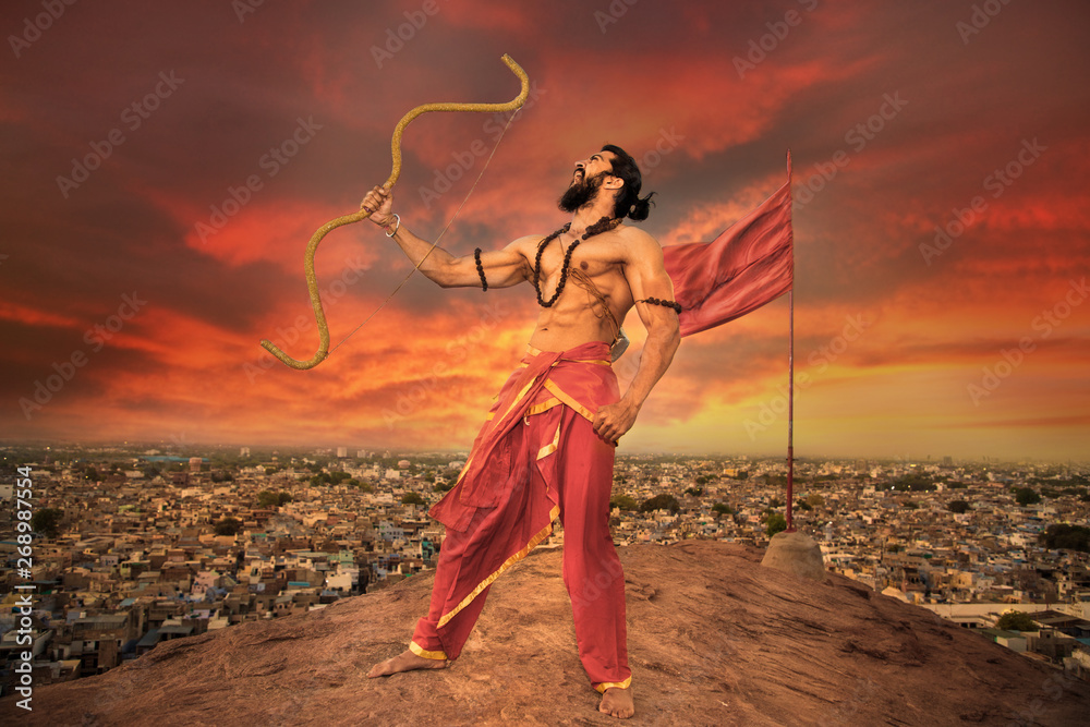 Indian man dressed up as Lord Rama with bow arrow, Ram Navami ...