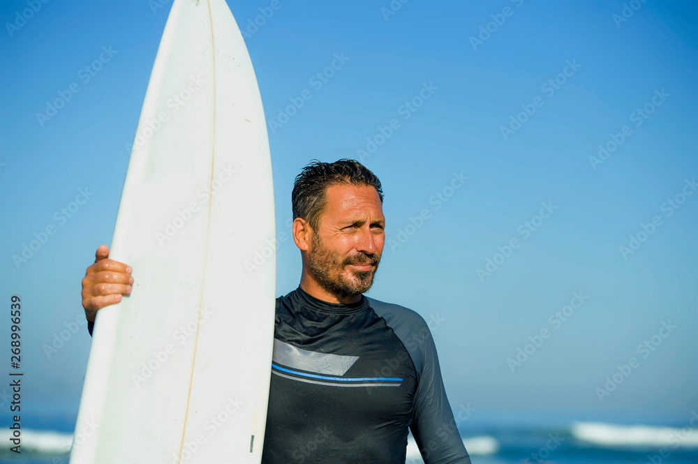 lifestyle portrait of attractive and cool surfer man 3os to 40s in ...